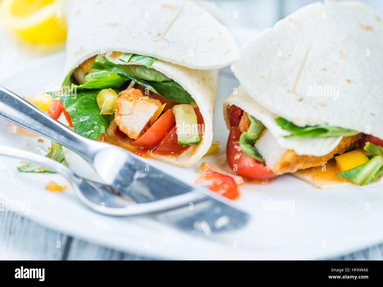 Fresh made Chicken Wraps on an vintage background (selective focus ...