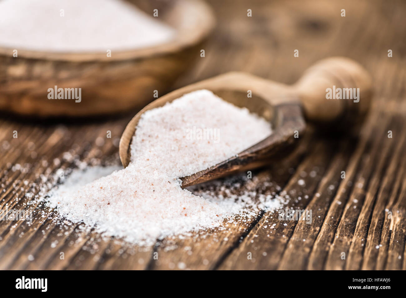 Himalayan Salt as high detailed close-up shot on a vintage wooden table ...