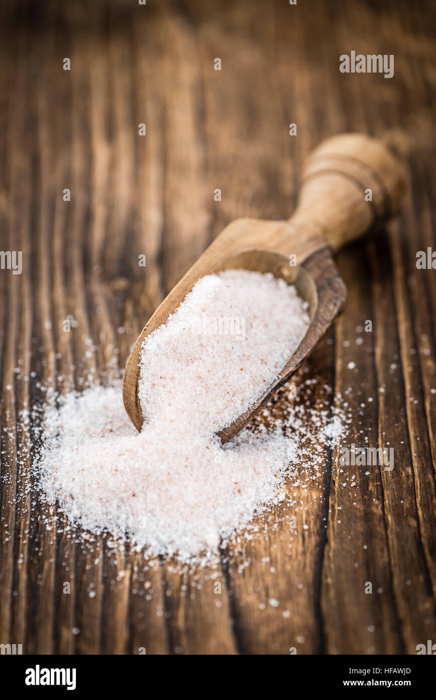 Pink Himalayan Salt on an old wooden table as detailed close-up shot ...