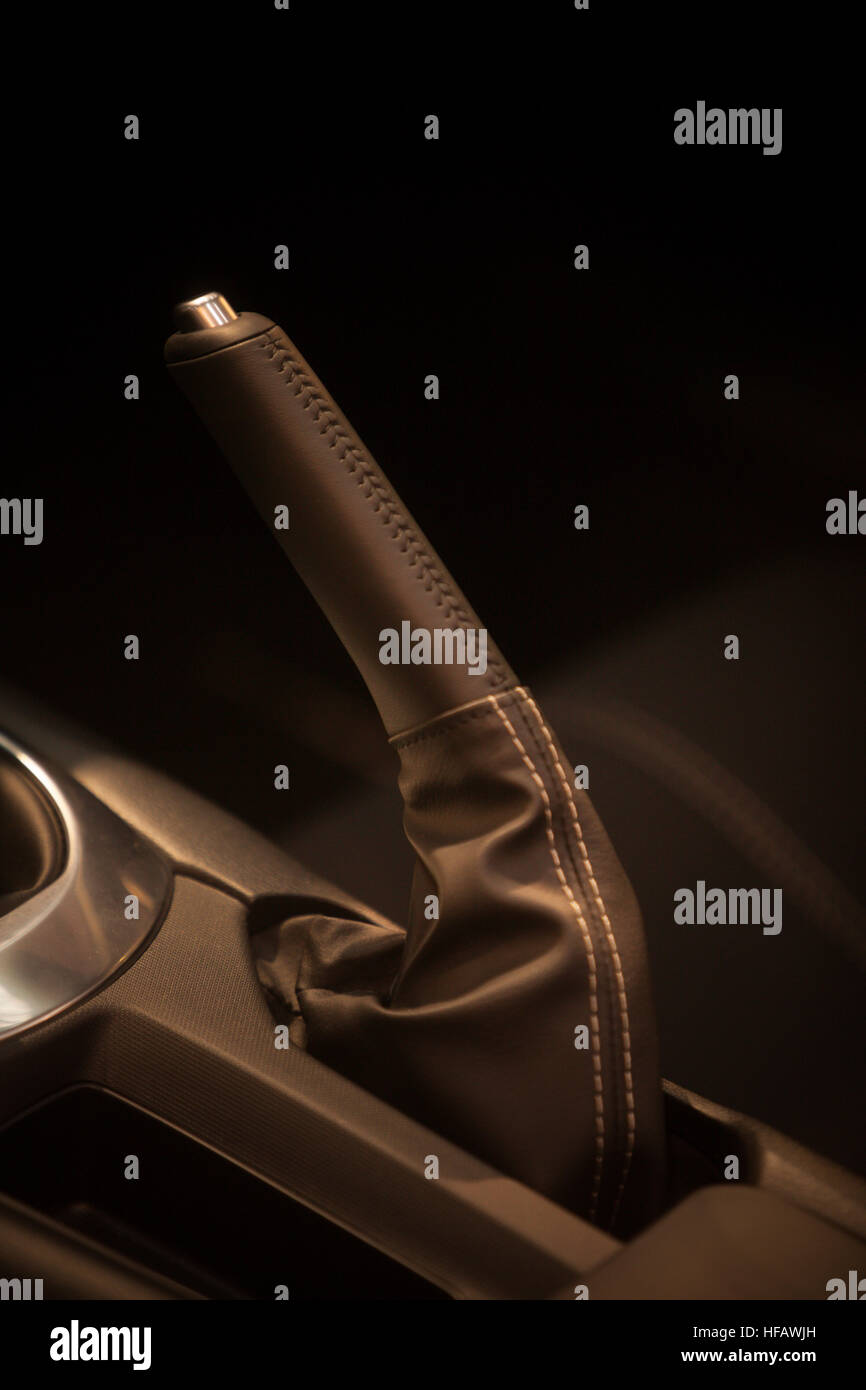 Close up shot of a parking brake lever inside a car Stock Photo - Alamy