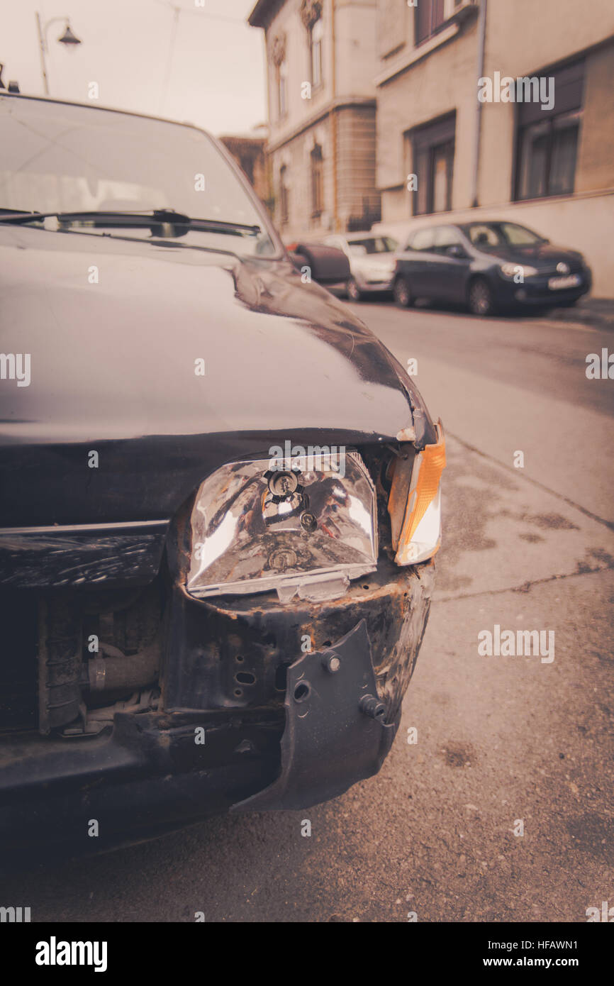 Color image of a crashed car with broken headlight Stock Photo - Alamy