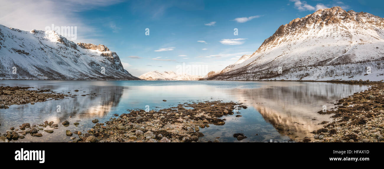 Panoramic view at fjord by the cold sea with snowy peaks in the ...