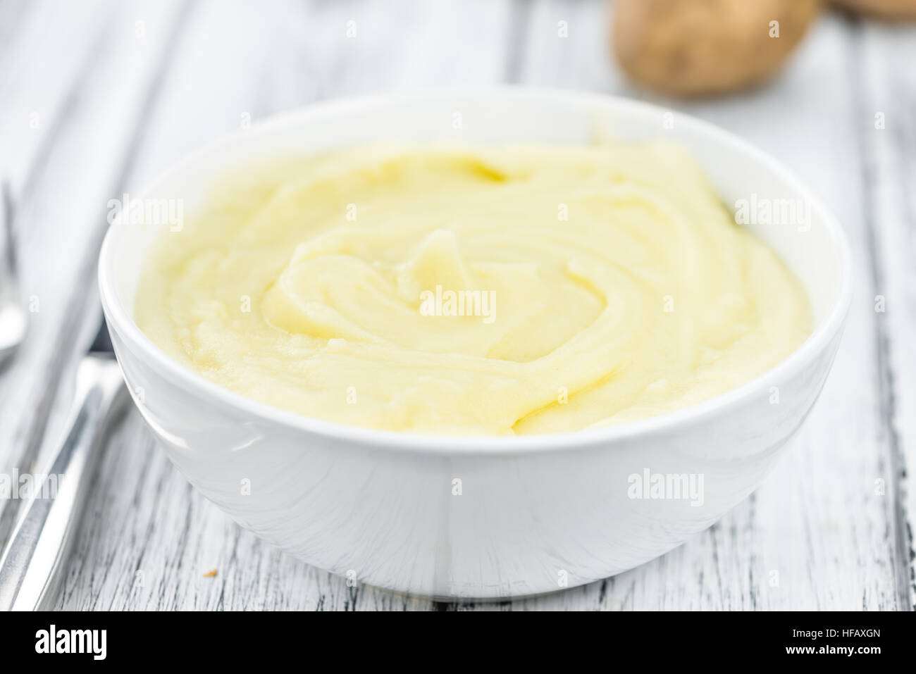 Potato Mash on rustic wooden background (close-up shot Stock Photo - Alamy