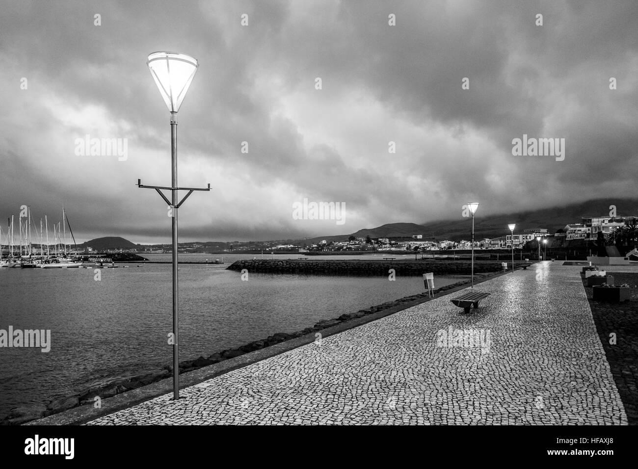 The beach port marina in Lajes Azores cobbled street stone cloud lamp ...