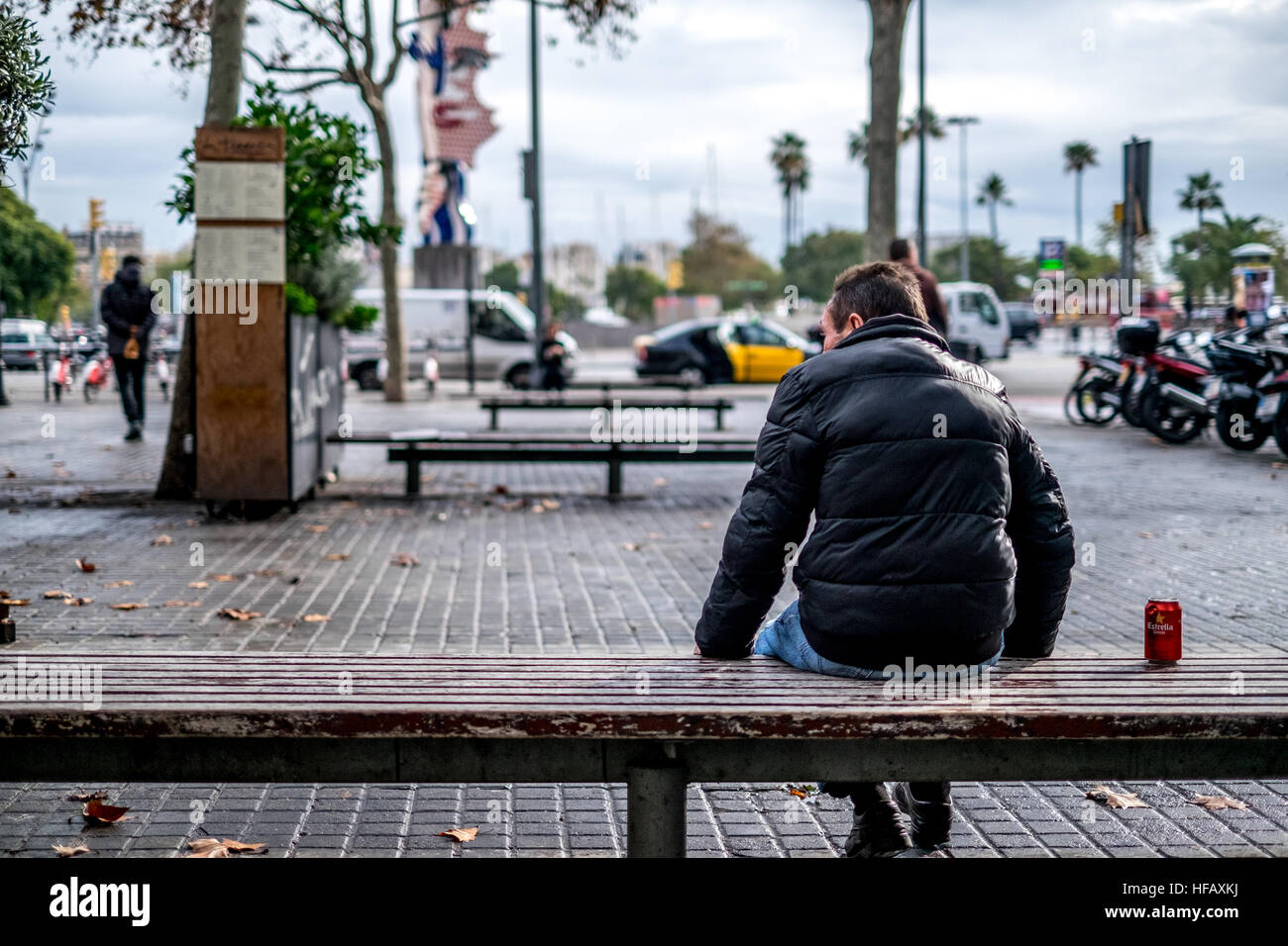 Man sits on bench in hi-res stock photography and images - Alamy