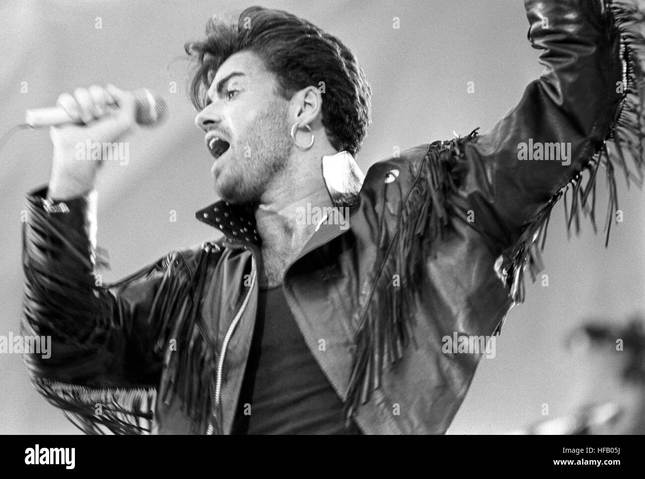 George Michael on stage at Wembley Stadium for the Wham! sell-out ...
