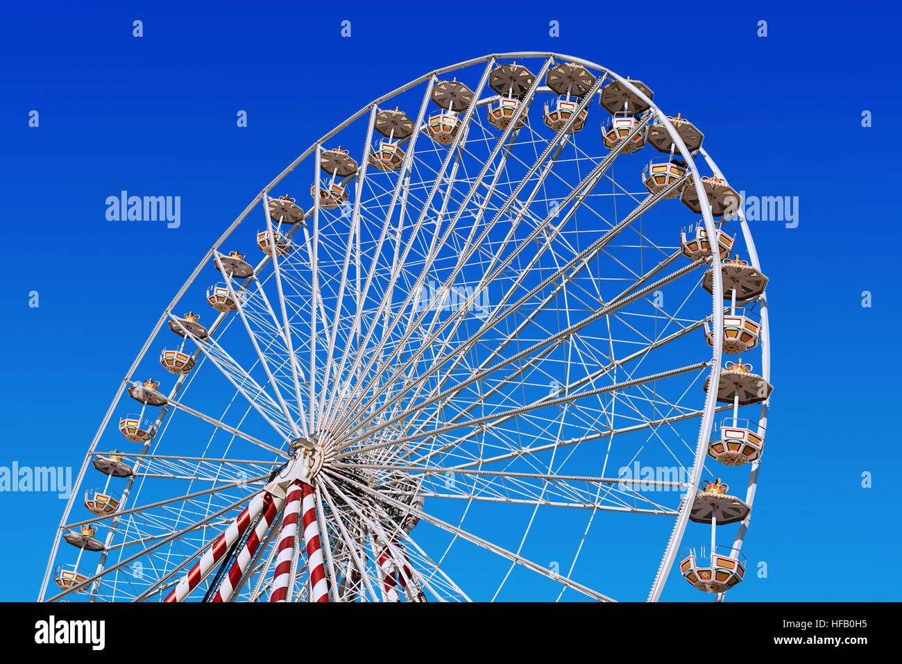 circular big ferris wheel on blue sky background Stock Photo - Alamy