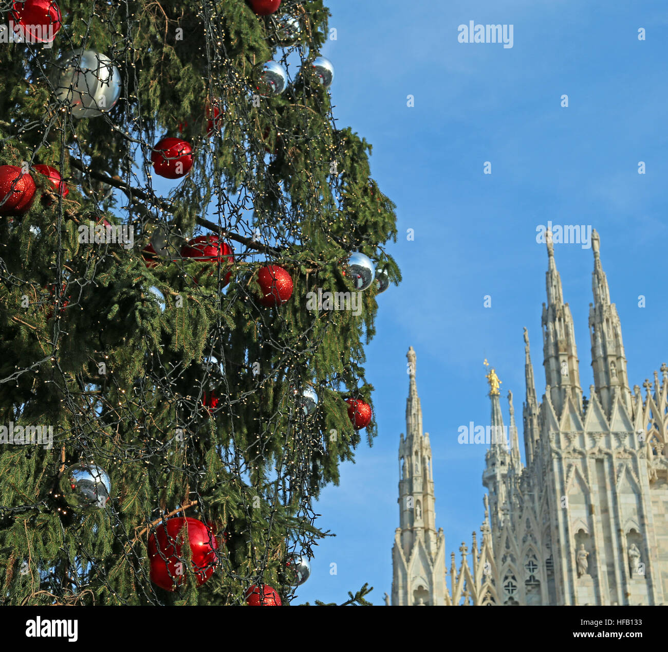 Milan Cathedral and the big Christmas tree with red and silver balls ...