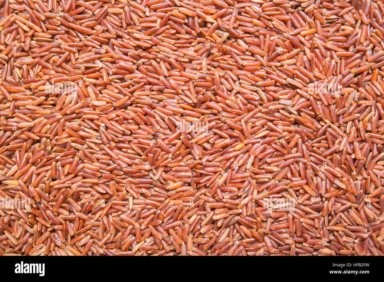 red rice background, backdrop or texture Stock Photo - Alamy