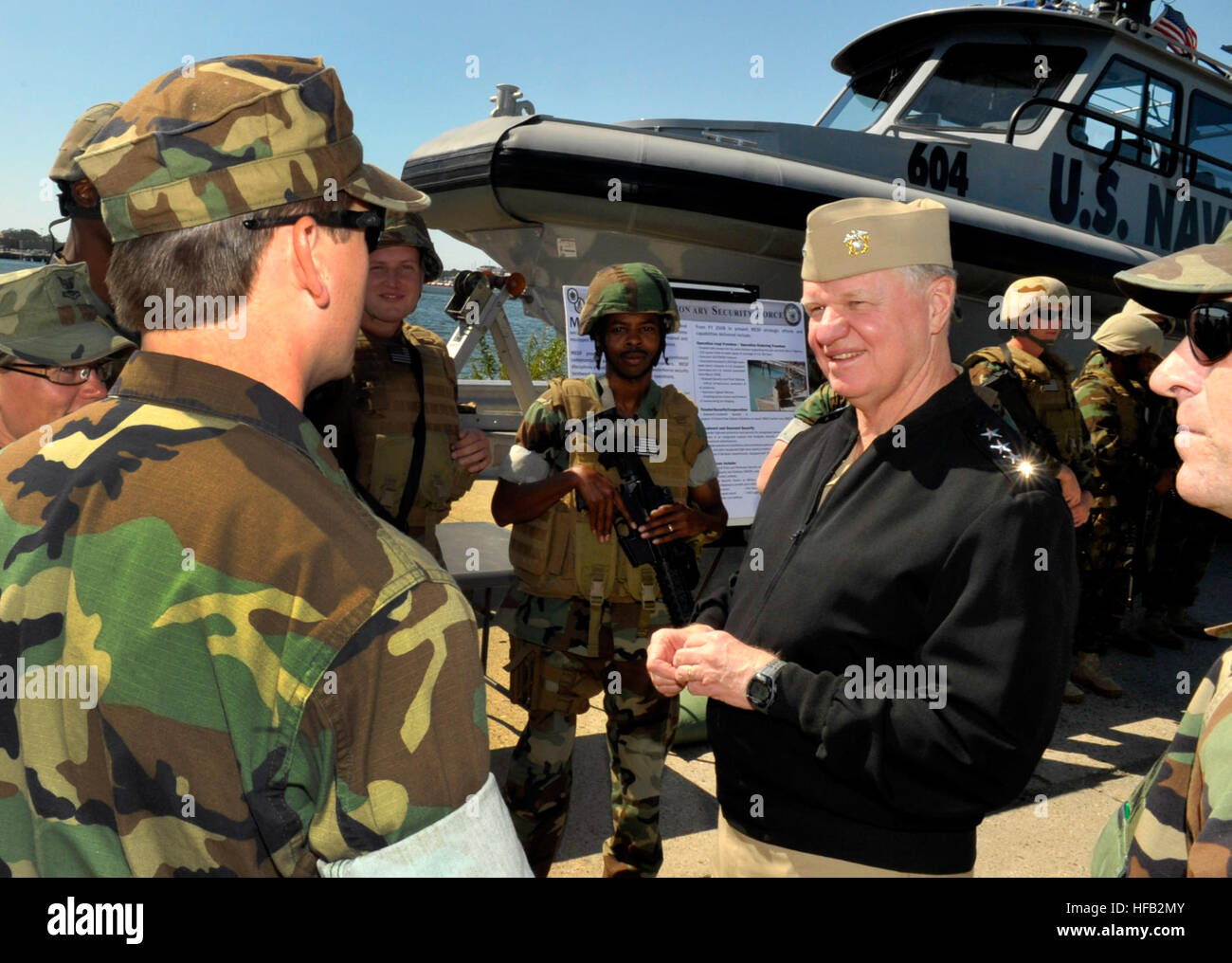 U.S. Navy Chief of Naval Operations Adm. Gary Roughead speaks with ...