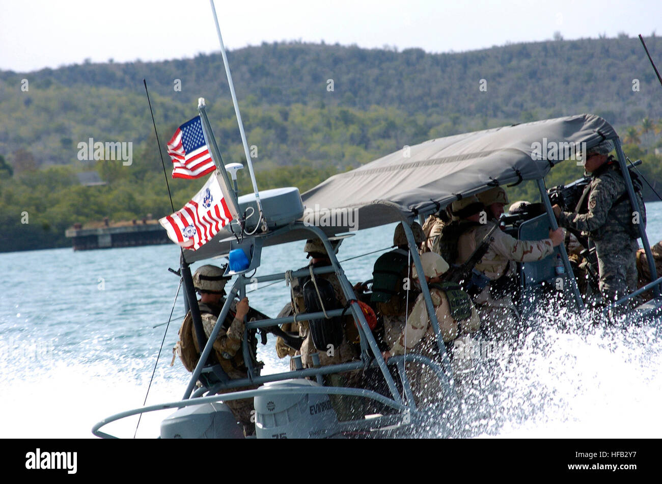 A Coast Guard transportable port security boat brings Marines to an ...