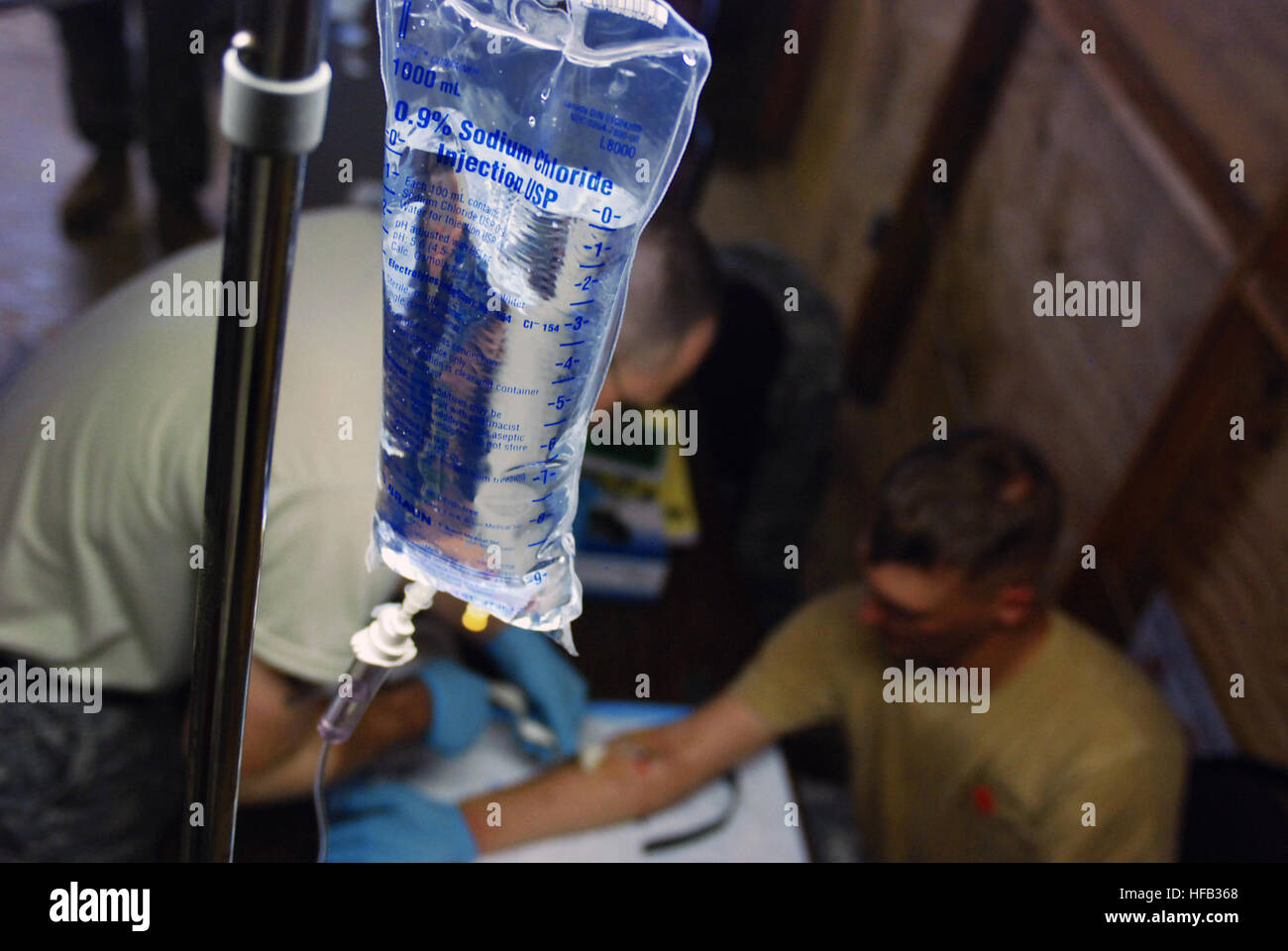 Army Staff Sgt. Andrew Woodward gives intravenous fluids to Army Staff ...