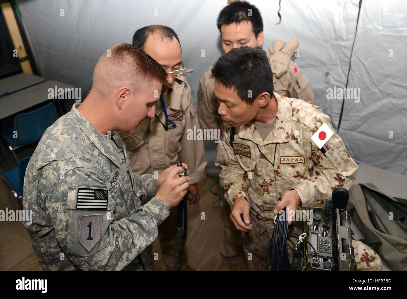U.S. Army 1st Lt. Christopher Hoff inspects radio equipment with ...
