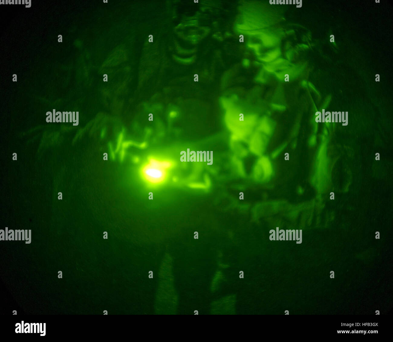 A Sensitive Site Exploitation team member fingerprints a villager ...