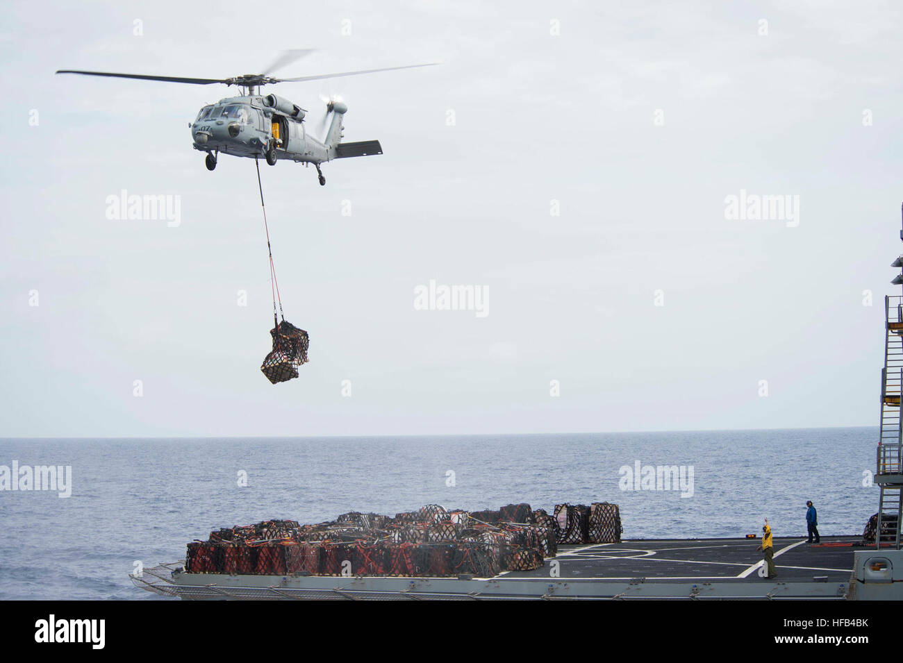 An MH-60S Sea Hawk from HCS-22 conducted cargo operations during ...