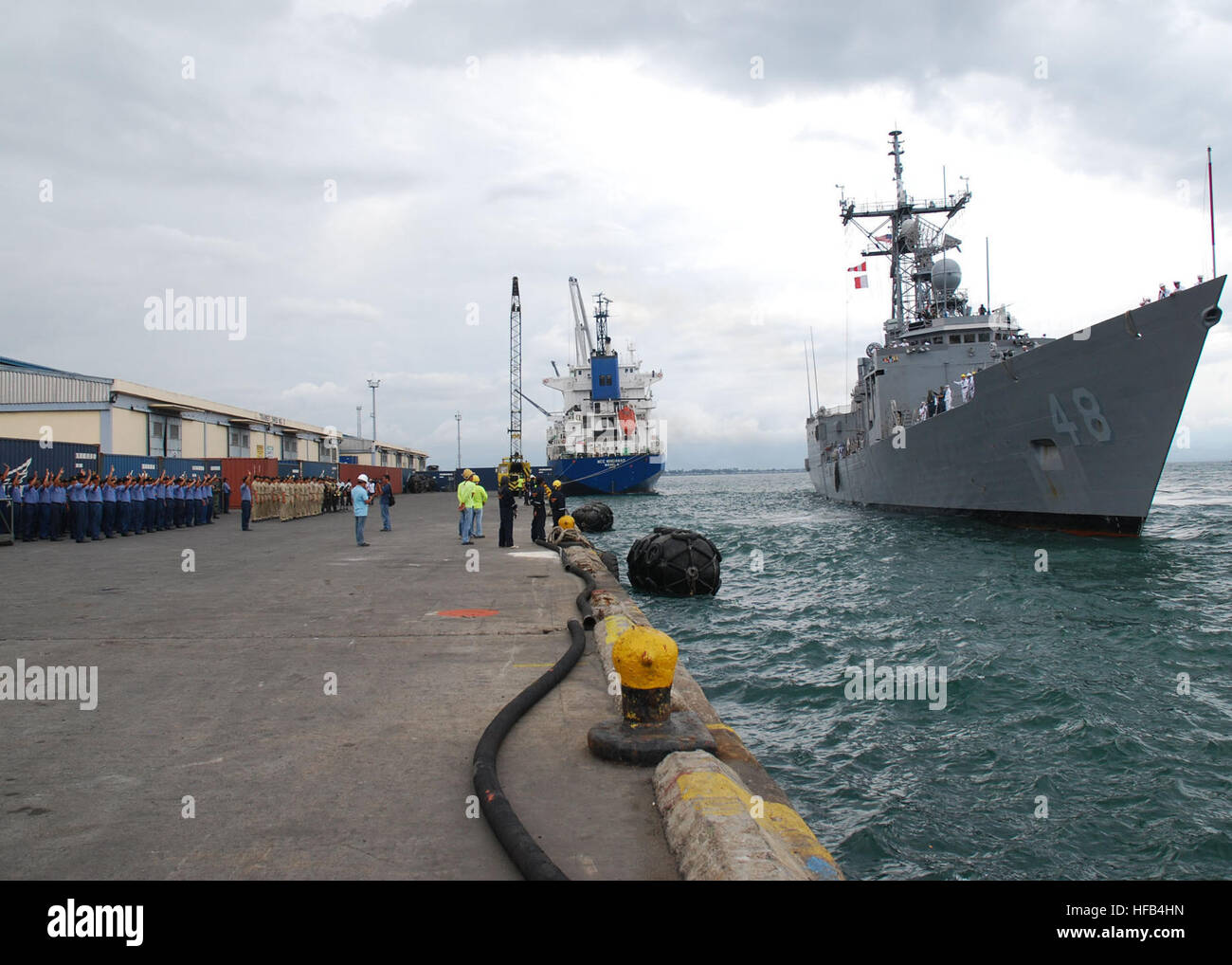 Philippine sailors wave as the guided-missile frigate USS Vandegrift ...