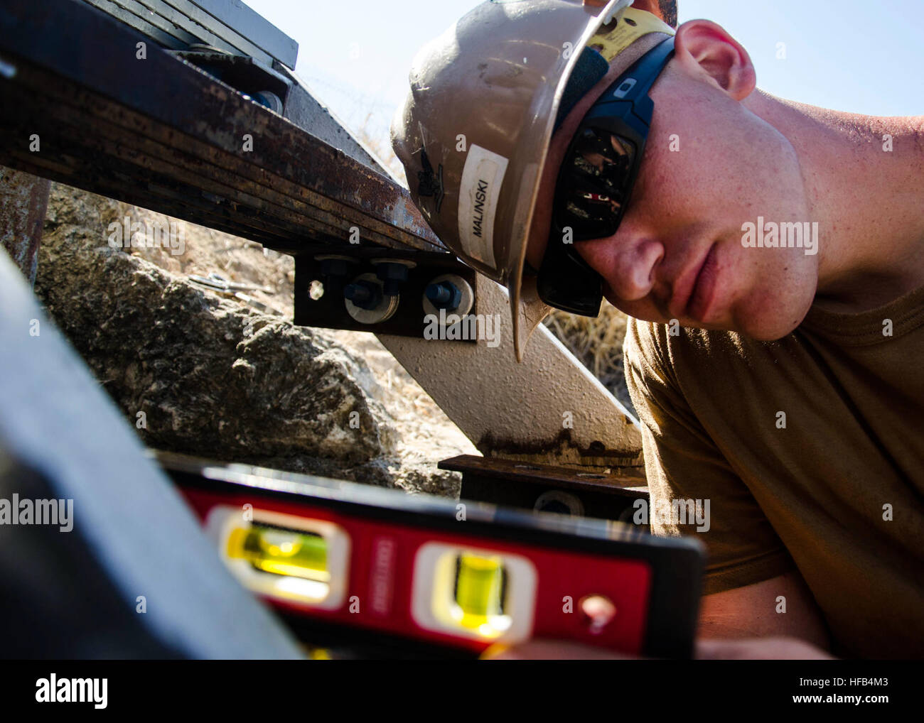 U.S. Navy Builder 3rd Class Eric Malinski, assigned to the Public Works ...