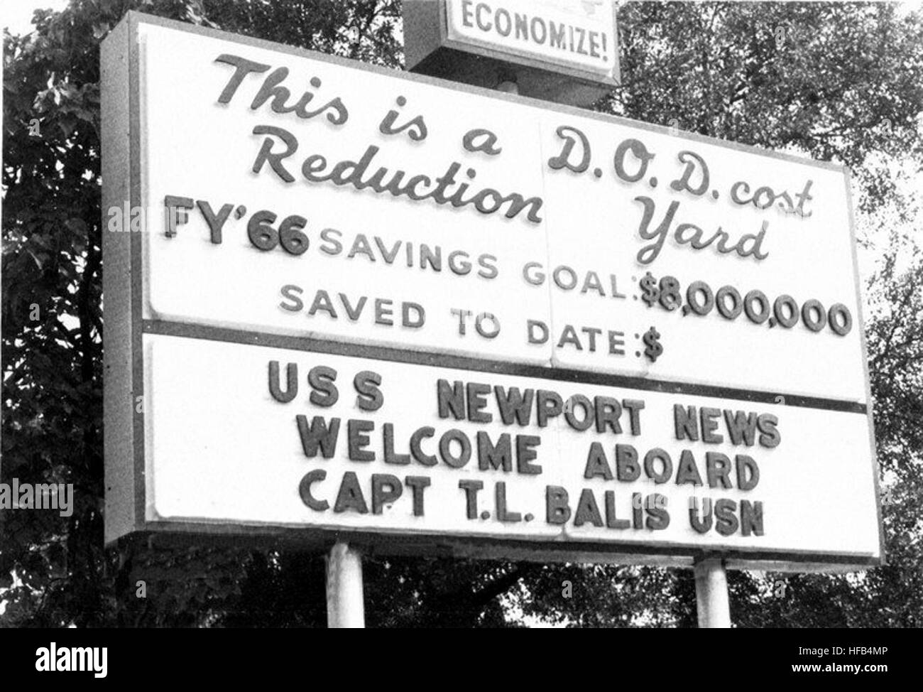 Cost reduction sign at Norfolk Naval Shipard in 1965 Stock Photo - Alamy