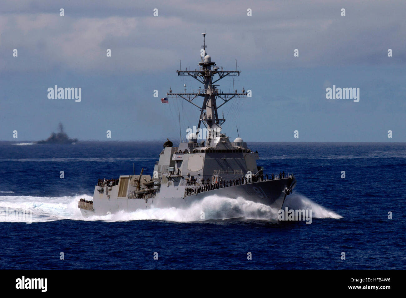 Guided-missile destroyer USS Pickney (DDG 91) performs a crash back ...