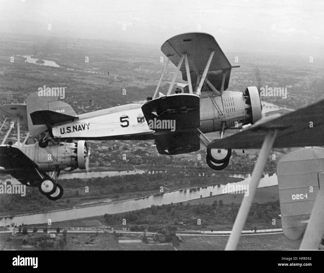 Curtiss O2C-1 biplanes in flight during the 1930s, demonstrating early ...
