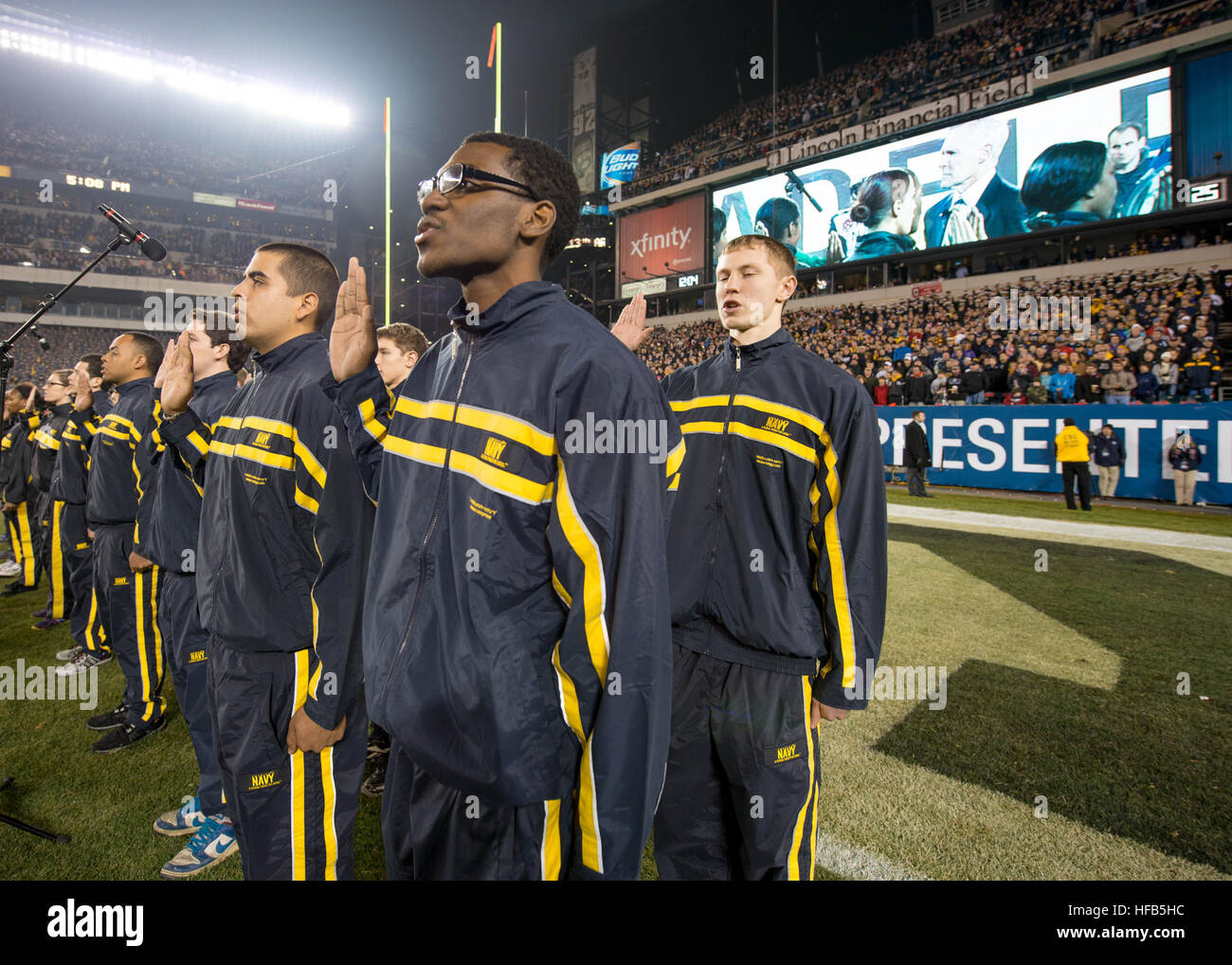 Secretary of the Navy Ray Mabus administers the oath of enlistment to ...