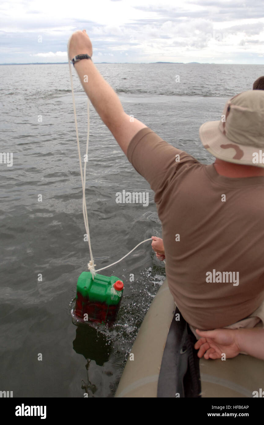 U.S. Navy Hospital Corpsman 1st Class Jeffrey Geiser places a marker in ...