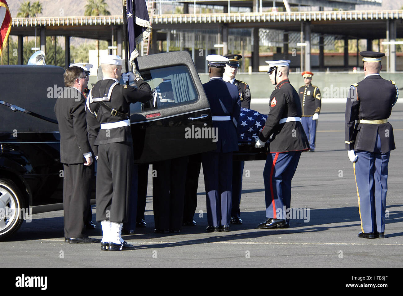 Members of the Armed Forces Honor Guard remove the casket of former ...