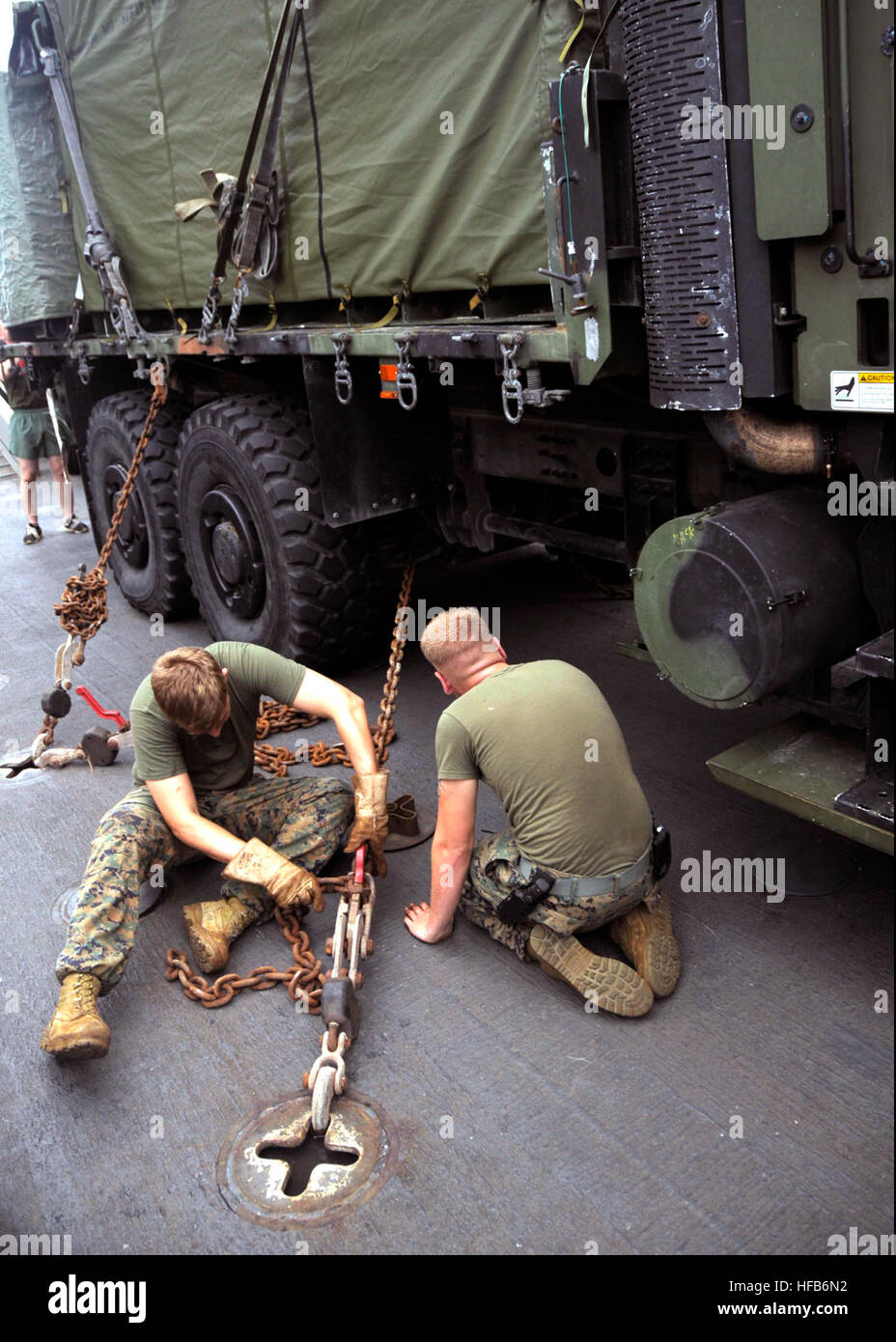 U.S. Marines from Combat Logistics Battalion 31 chain down a tactical ...