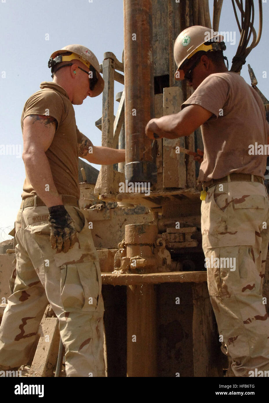 U.S. Navy Construction Mechanic 3rd Class Lucas McCleery, left, and U.S ...