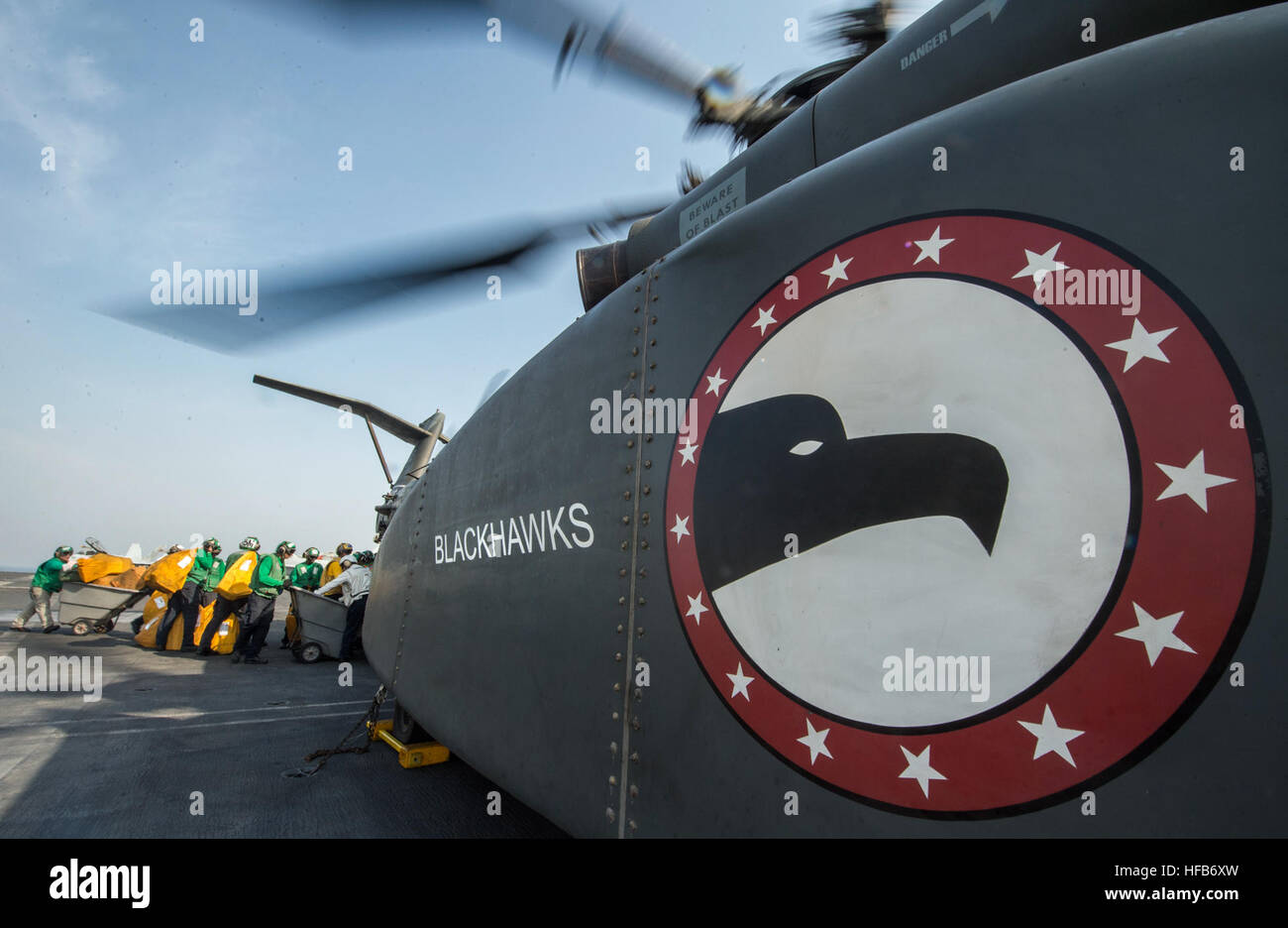 Crew members from Helicopter Mine Countermeasure Squadron 15 and USS ...