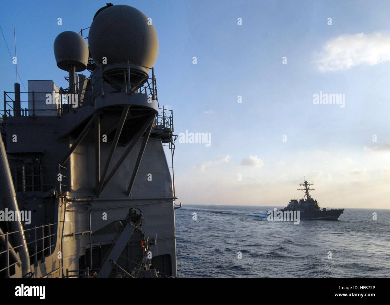The guided-missile destroyer USS Decatur passes along the port side of ...