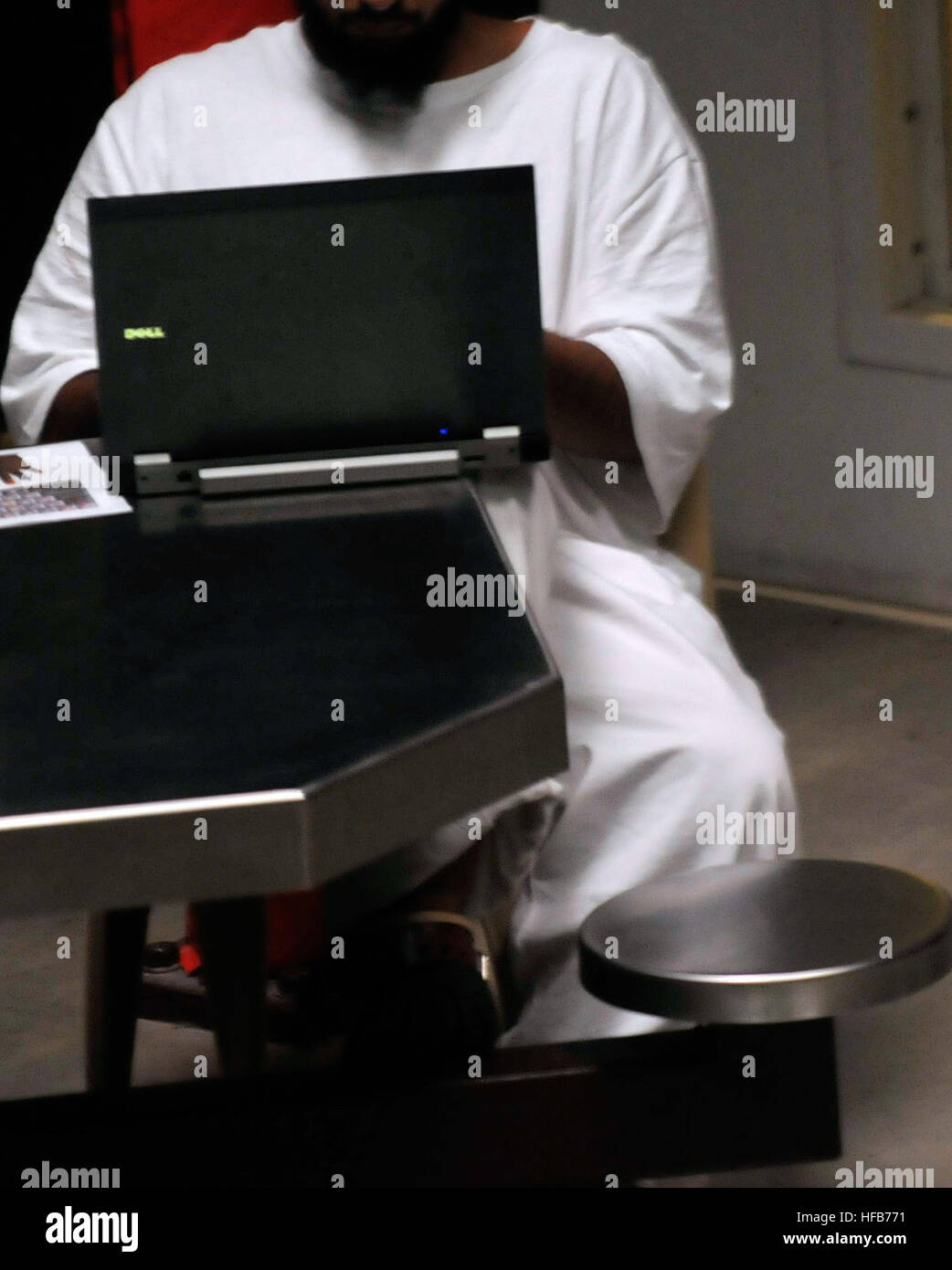 A detainee learns typing skills during a life skills class in Camp Six ...