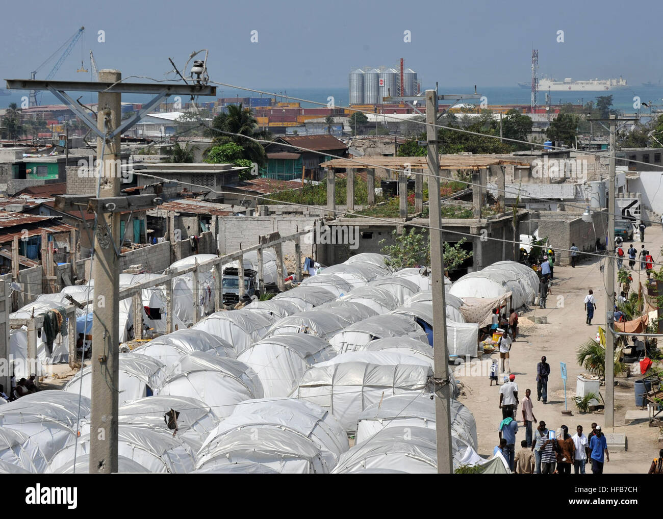 Displaced Haitian citizens find shelter in a temporary settlement near ...