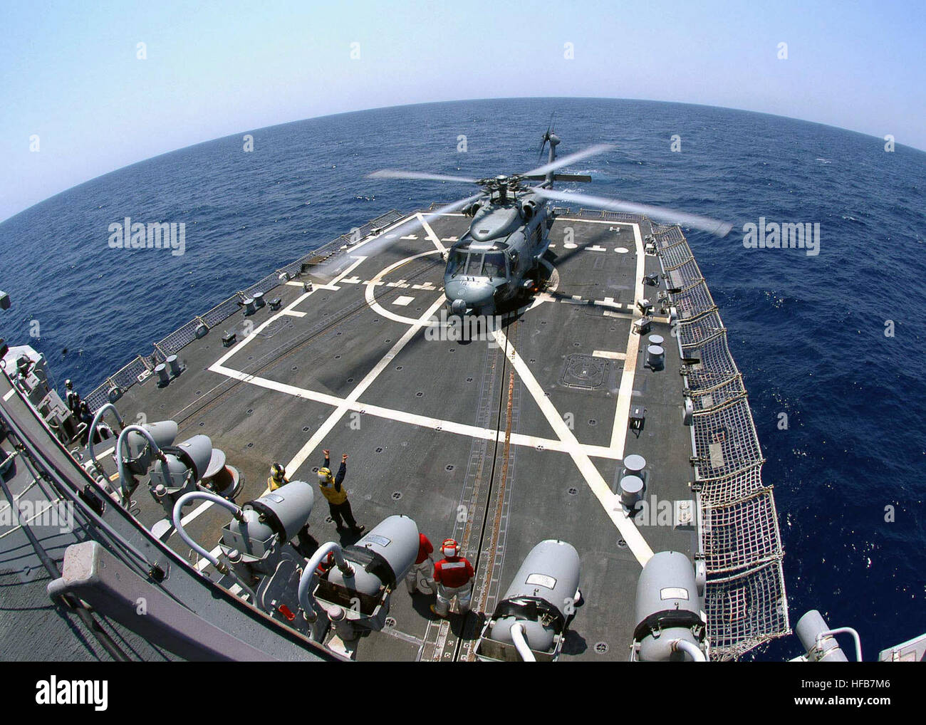 A US Navy (USN) SH-60 Sea Hawk helicopter assigned to the "Grandmasters ...
