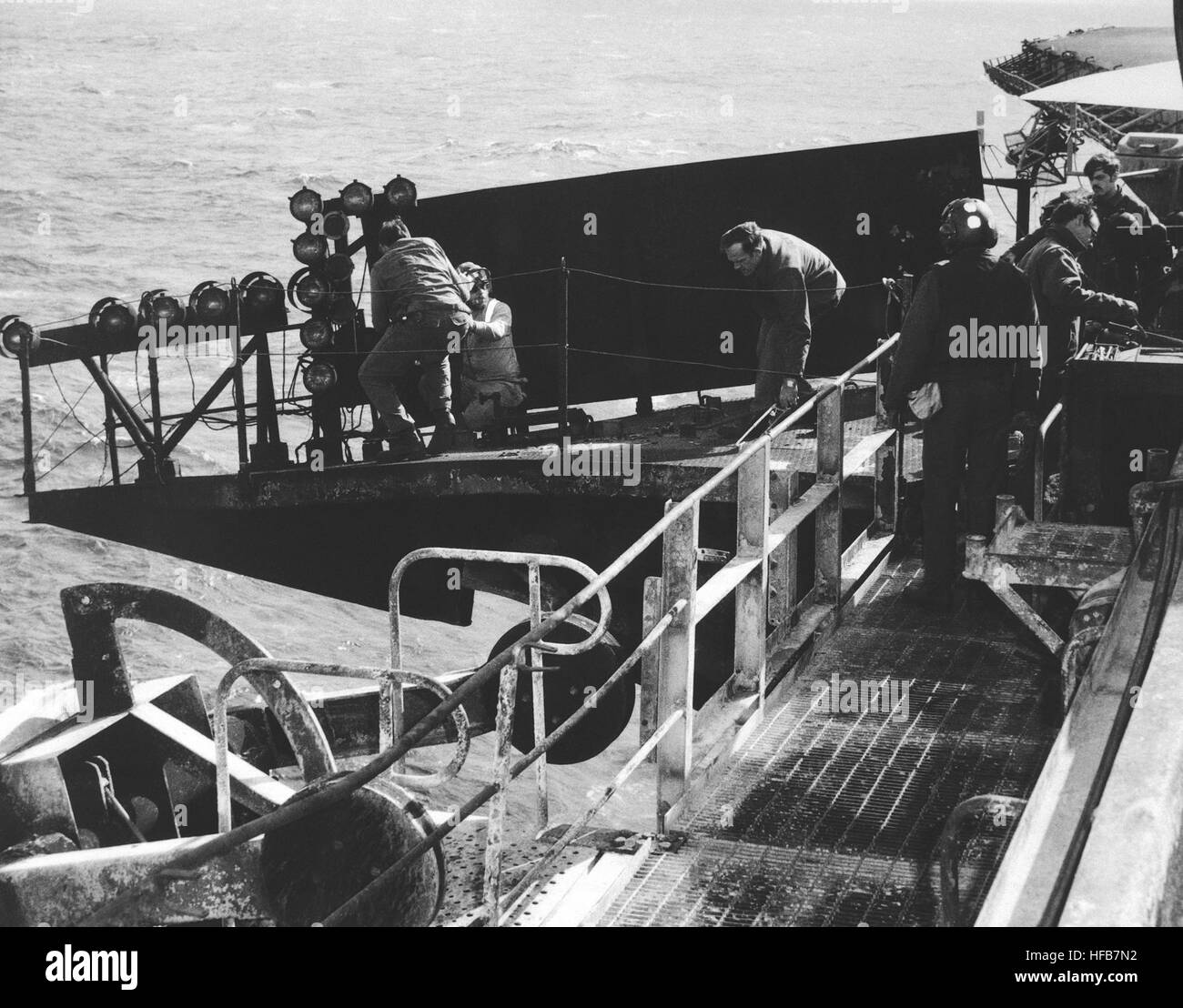 Ionian Sea. Crew members prepare to remove the Fresnel lens optical ...
