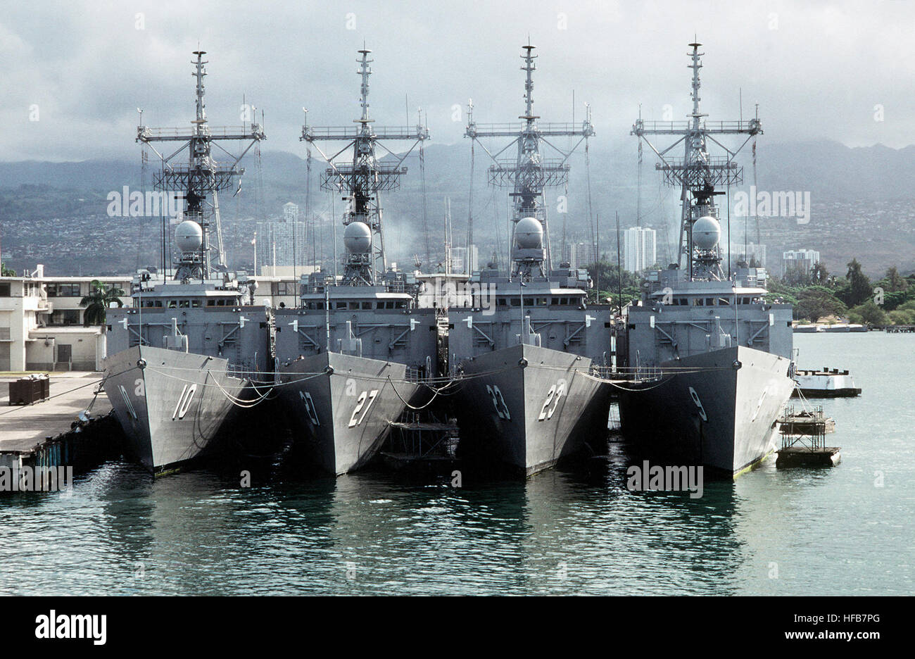 Four U.S. Navy guided missile frigates are moored side by side in the ...