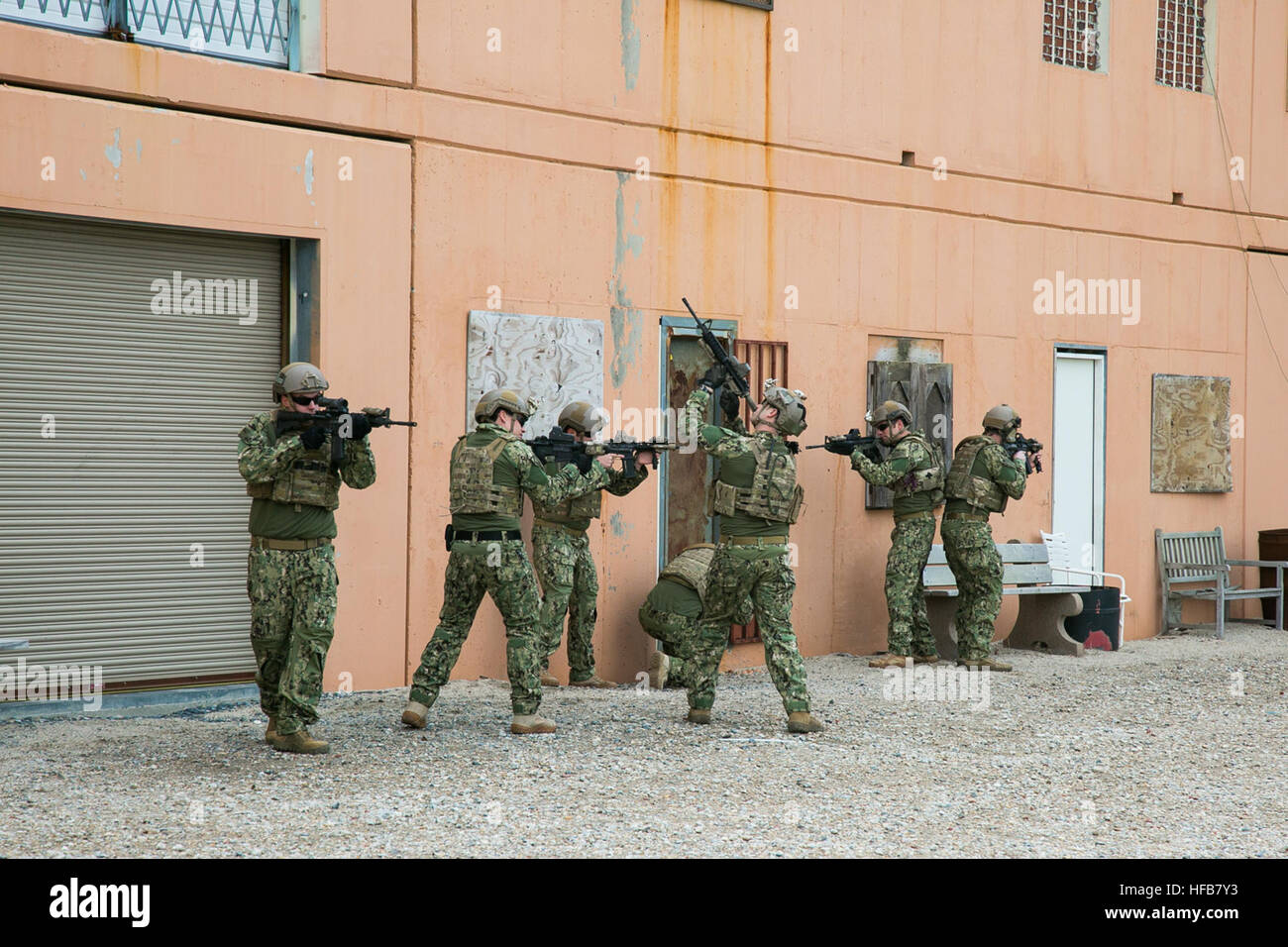Explosive Ordnance Disposal Technicians conduct a door breach training ...