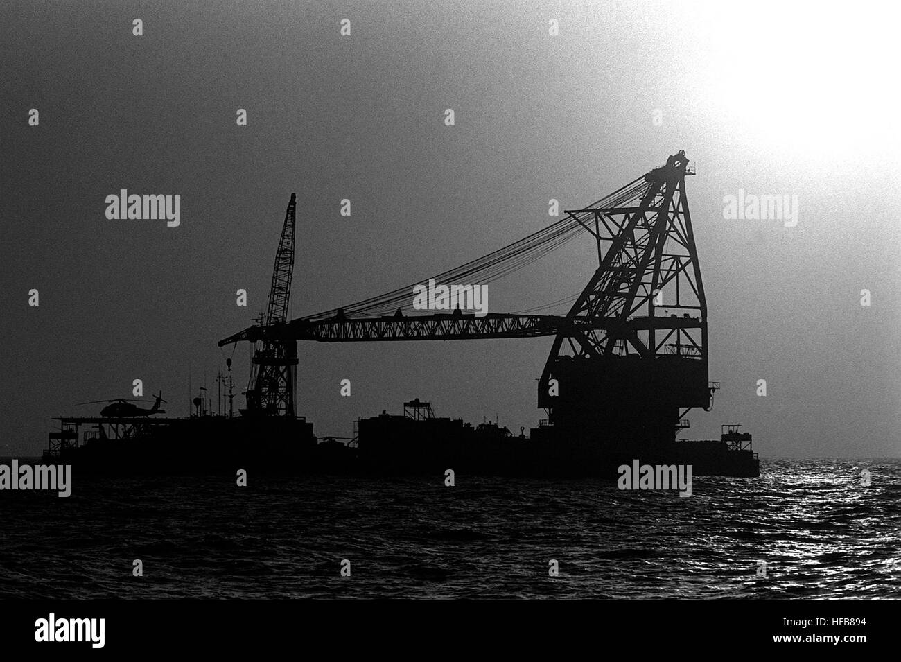 A silhouetted view of the barge Hercules, distinguished by its large ...