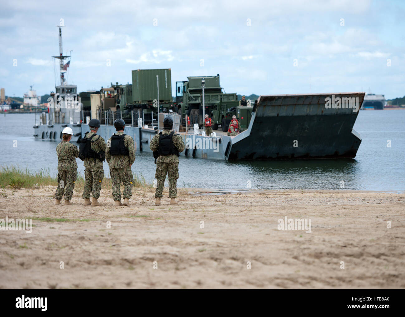 Sailors assigned to Beachmaster Unit (BMU) TWO observe an approaching ...