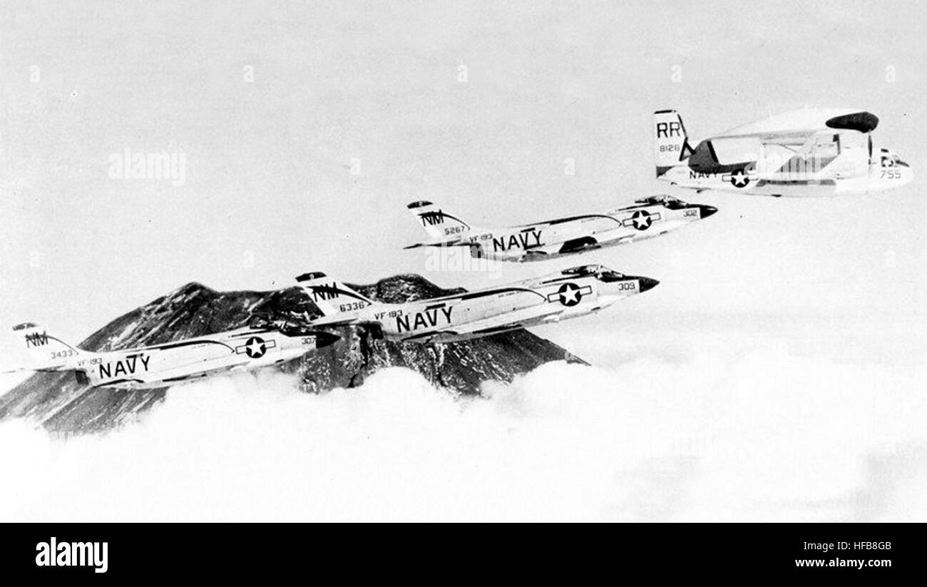 An E-1B Tracer aircraft of VAW-11 flies in formation with F-3B Demon ...
