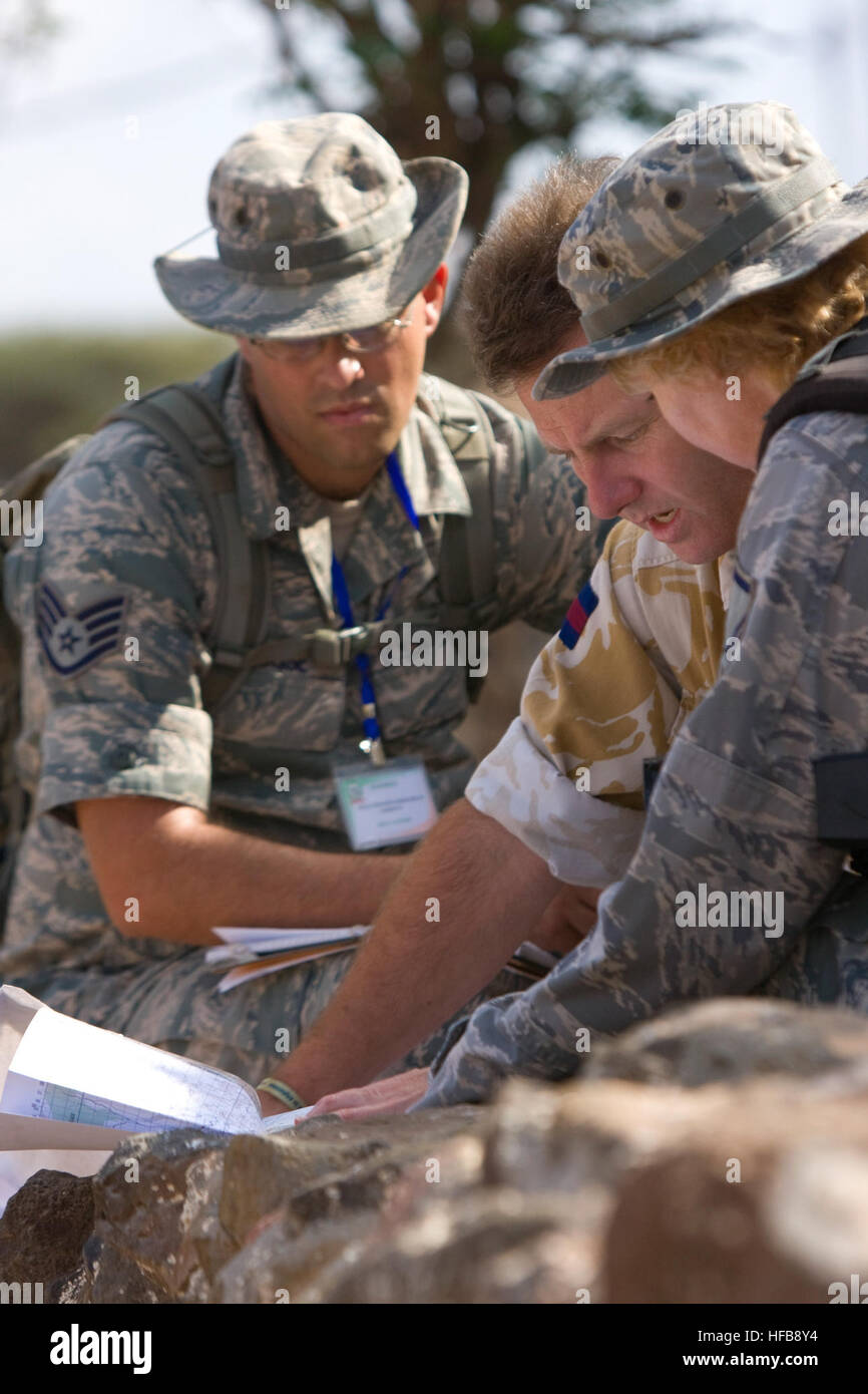 British Army Lt. Col. Stephen Segrave, center, gives field exercise ...