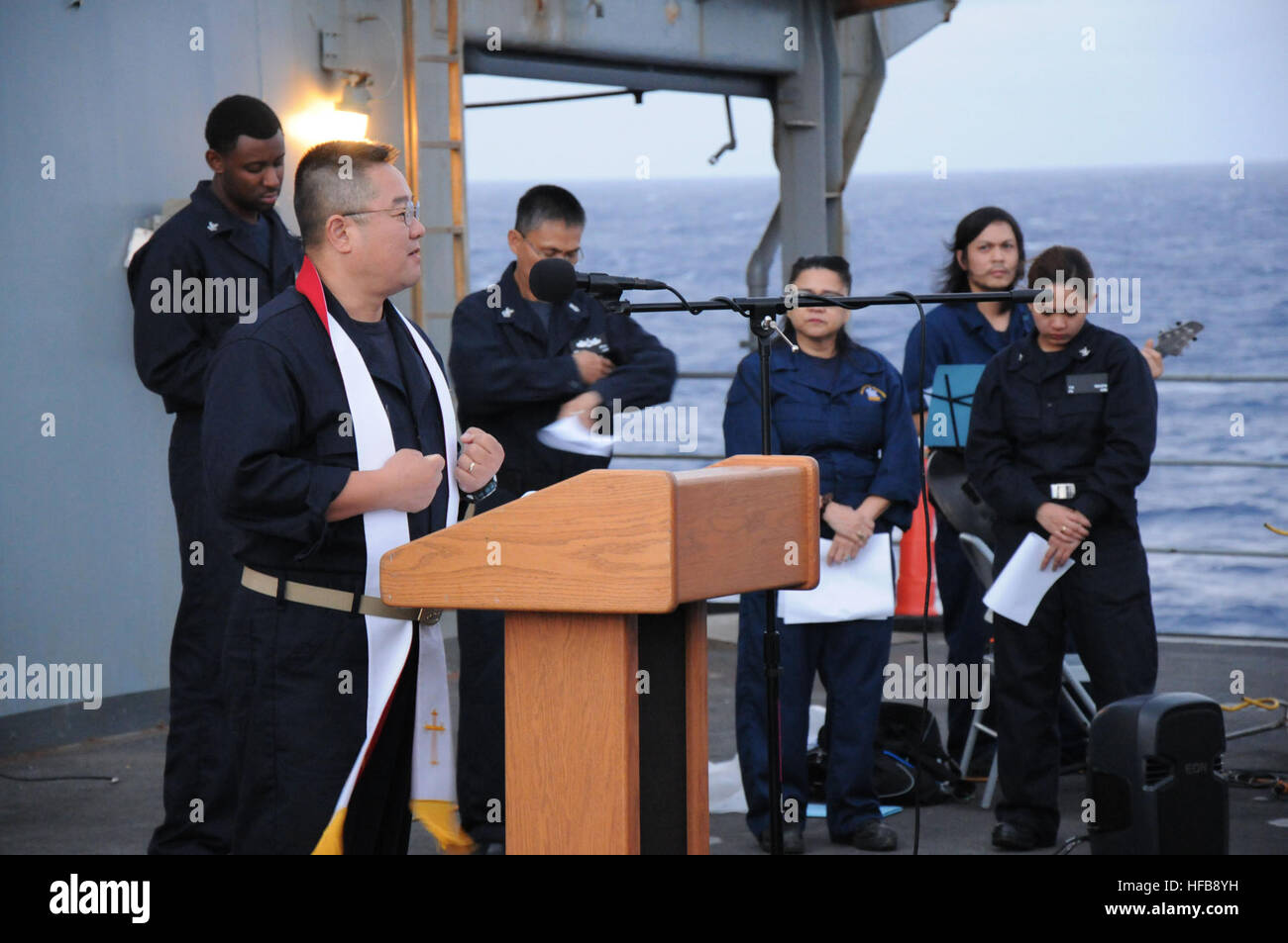 PHILIPPINE SEA (April 5, 2015) Lt. Cmdr. Louis Lee, left, command ...