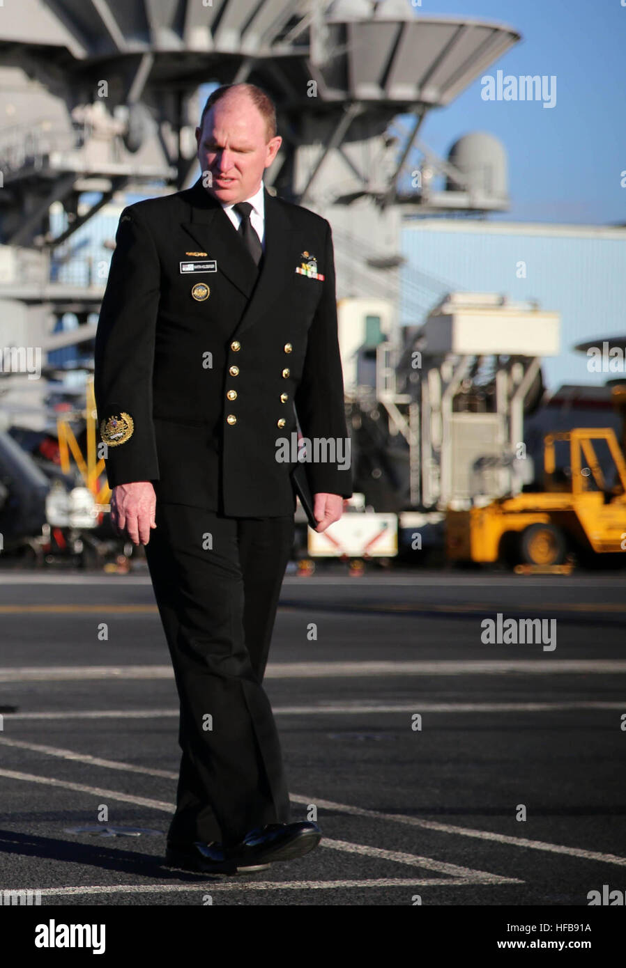 130802-N-XF988-395 Command Master Chief Joseph Fahrney, left, gives ...