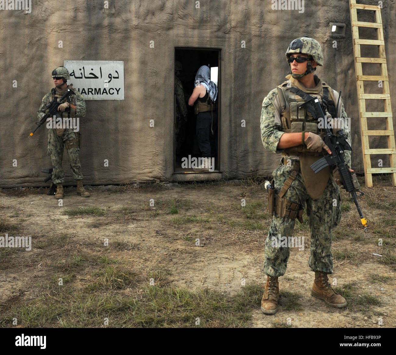 U.S. Sailors with a combat security team assigned to Naval Mobile ...