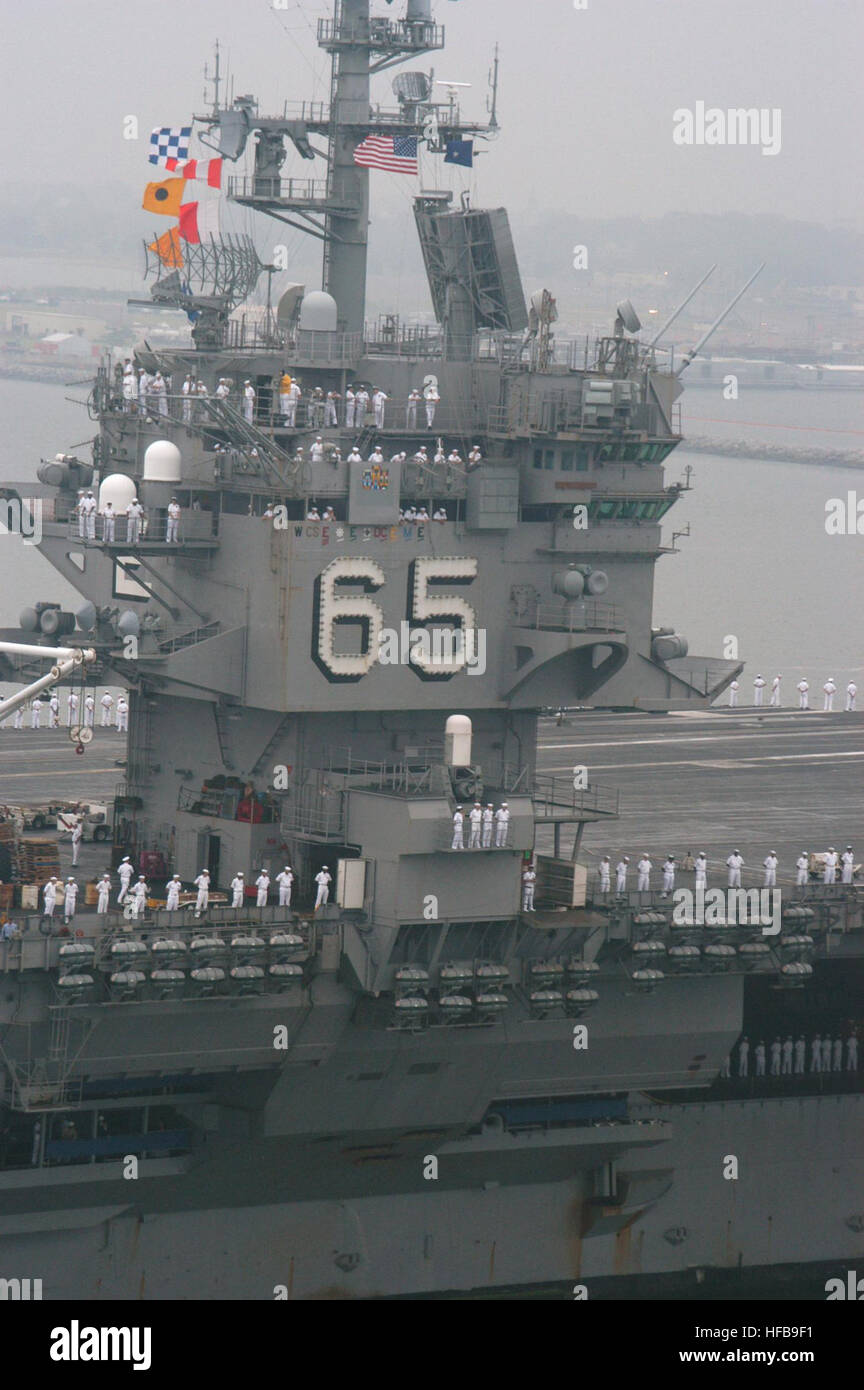 040723-N-7748K-071 Naval Station Norfolk, Va. (July 23, 2004)-- Sailors line the decks of the ...