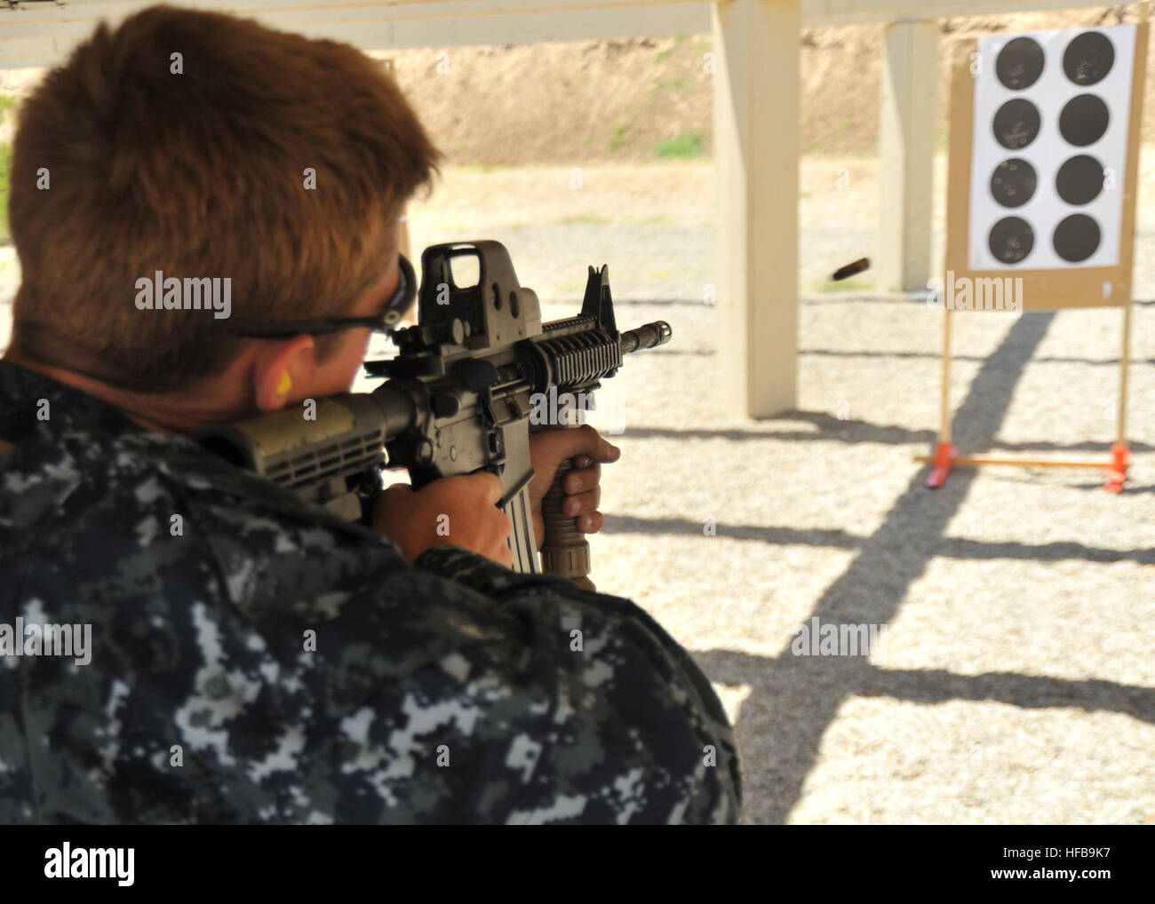 Midshipman Scott Kendrick fires an M-4 service rifle during the small ...