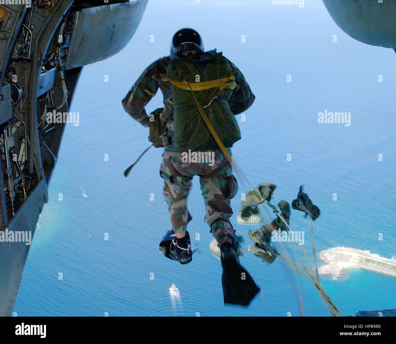 An EOD technician from EOD MU-5 conducts a static line water parachute ...