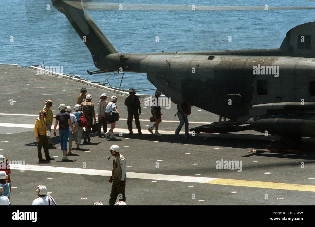 Dependents of U.S. military personnel board a Marine Heavy Helicopter ...