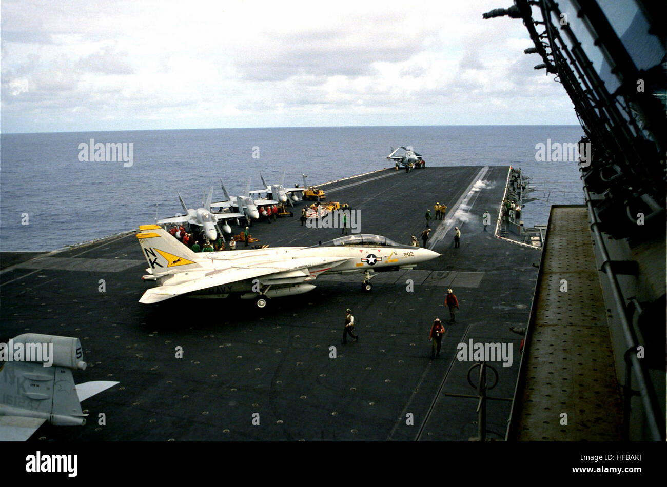 An F-14A Tomcat of VF-21 is positioned on the flight deck of USS ...