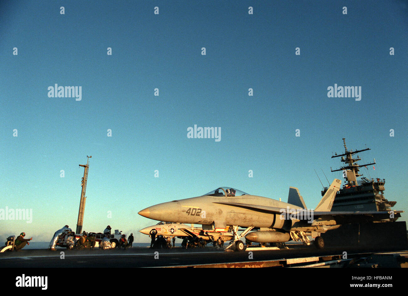 A Fighter-Attack Squadron 161 (VFA-161) F-18 Hornet aircraft is readied ...